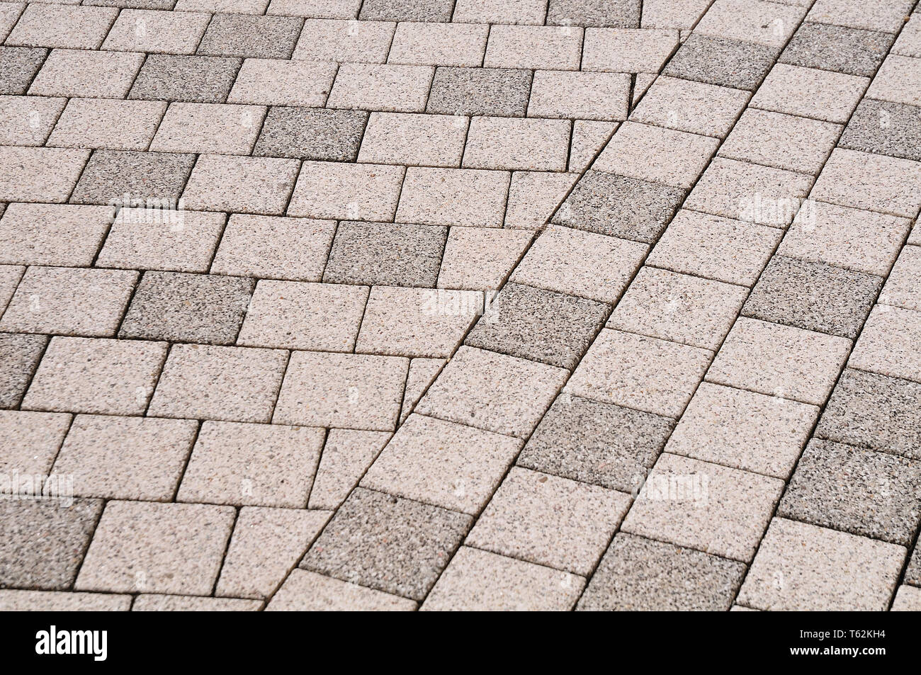 square shaped paving stones laid out on a sidewalk Stock Photo - Alamy