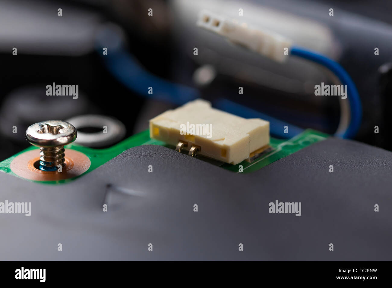 Metal bolt fastening. Computer connector and cable on the processor ...