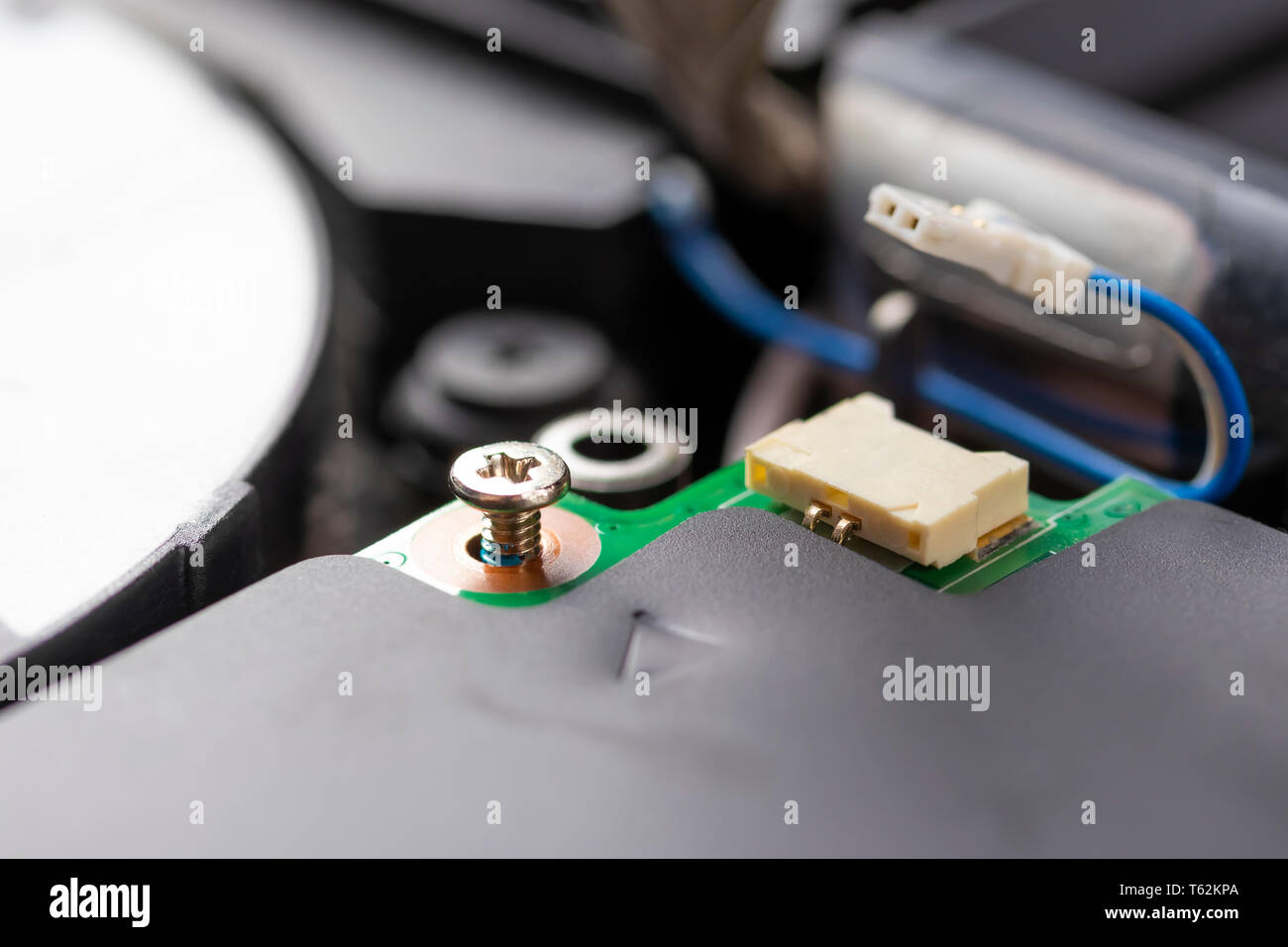 Metal bolt fastening. Computer connector and cable on the processor ...