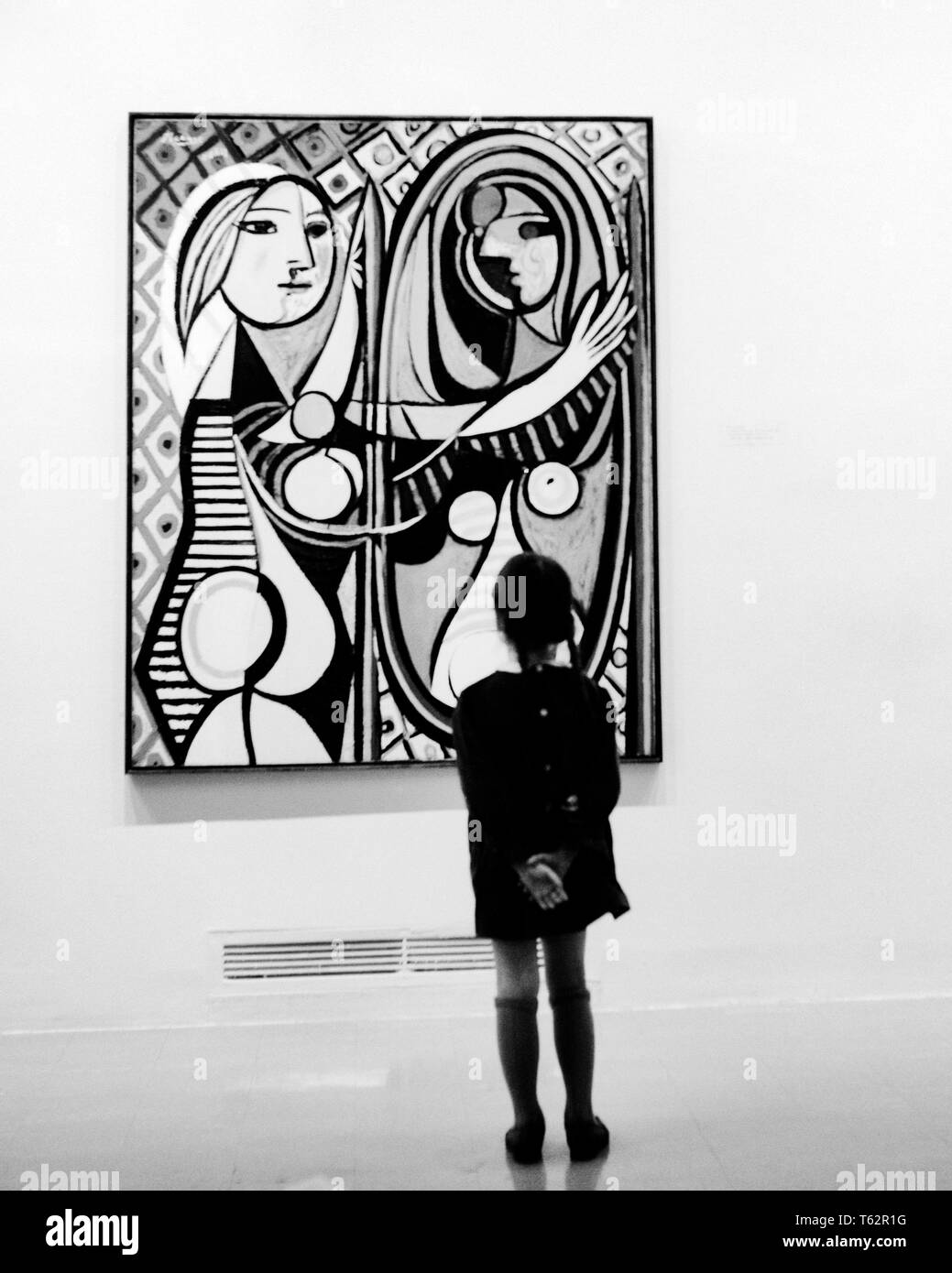 1970s SILHOUETTE YOUNG GIRL LOOKING AT PICASSO PAINTING OF WOMAN WITH ...