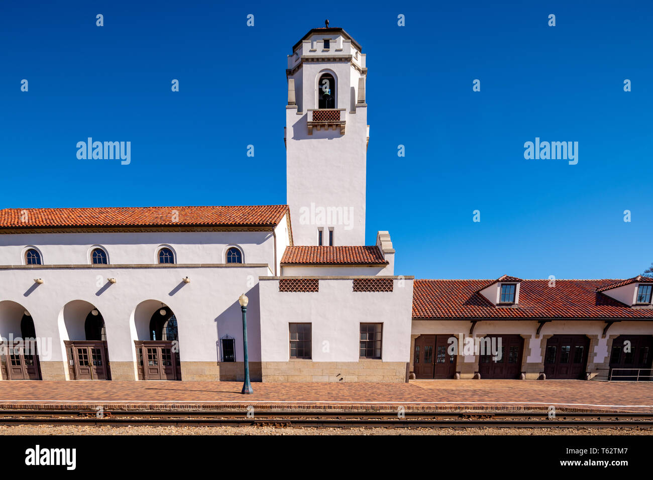 Rail tracks and loading platform at a local train depot Stock Photo - Alamy