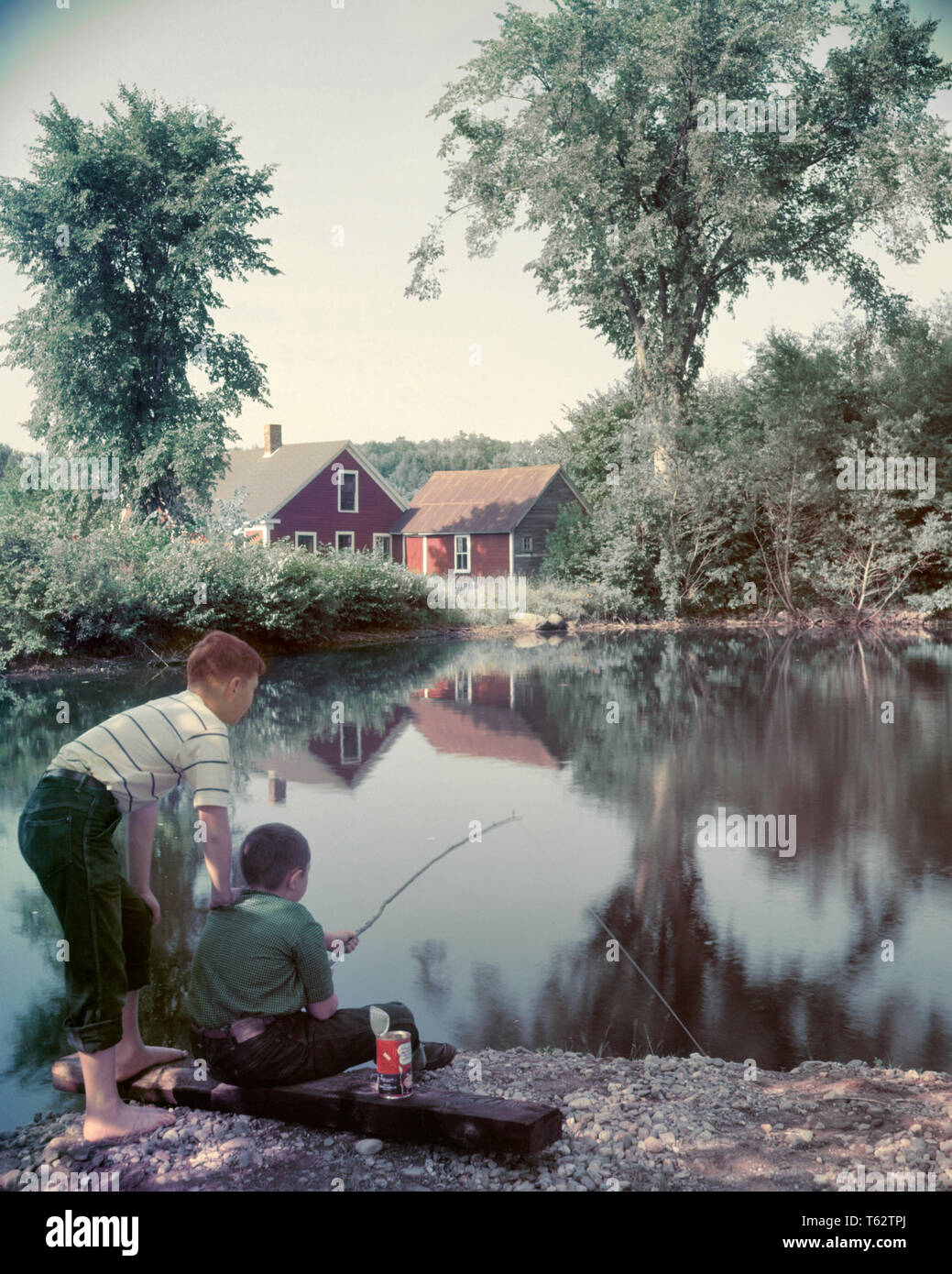 1950s BACK VIEW 2 BOYS FISHING IN FARM POND BAREFOOTED WITH CAN OF ...