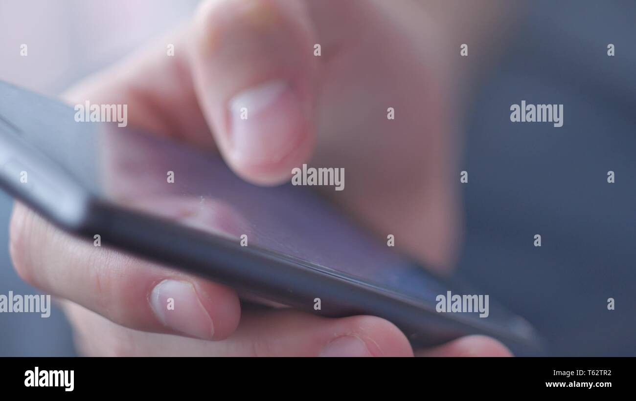 close-up hands using mobile phone touchscreen Stock Photo - Alamy