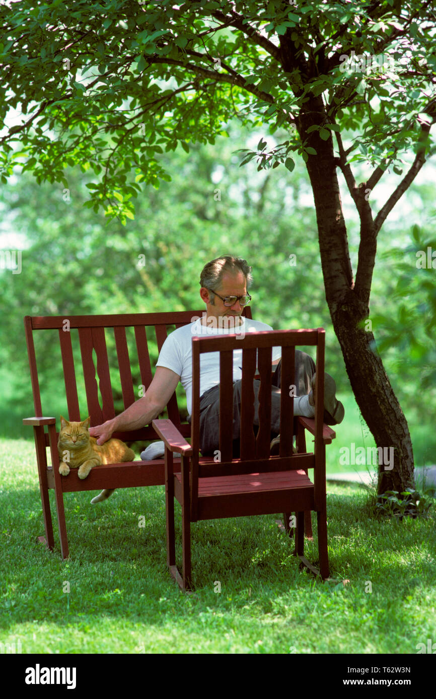 Old man sitting under shade hi-res stock photography and images - Alamy