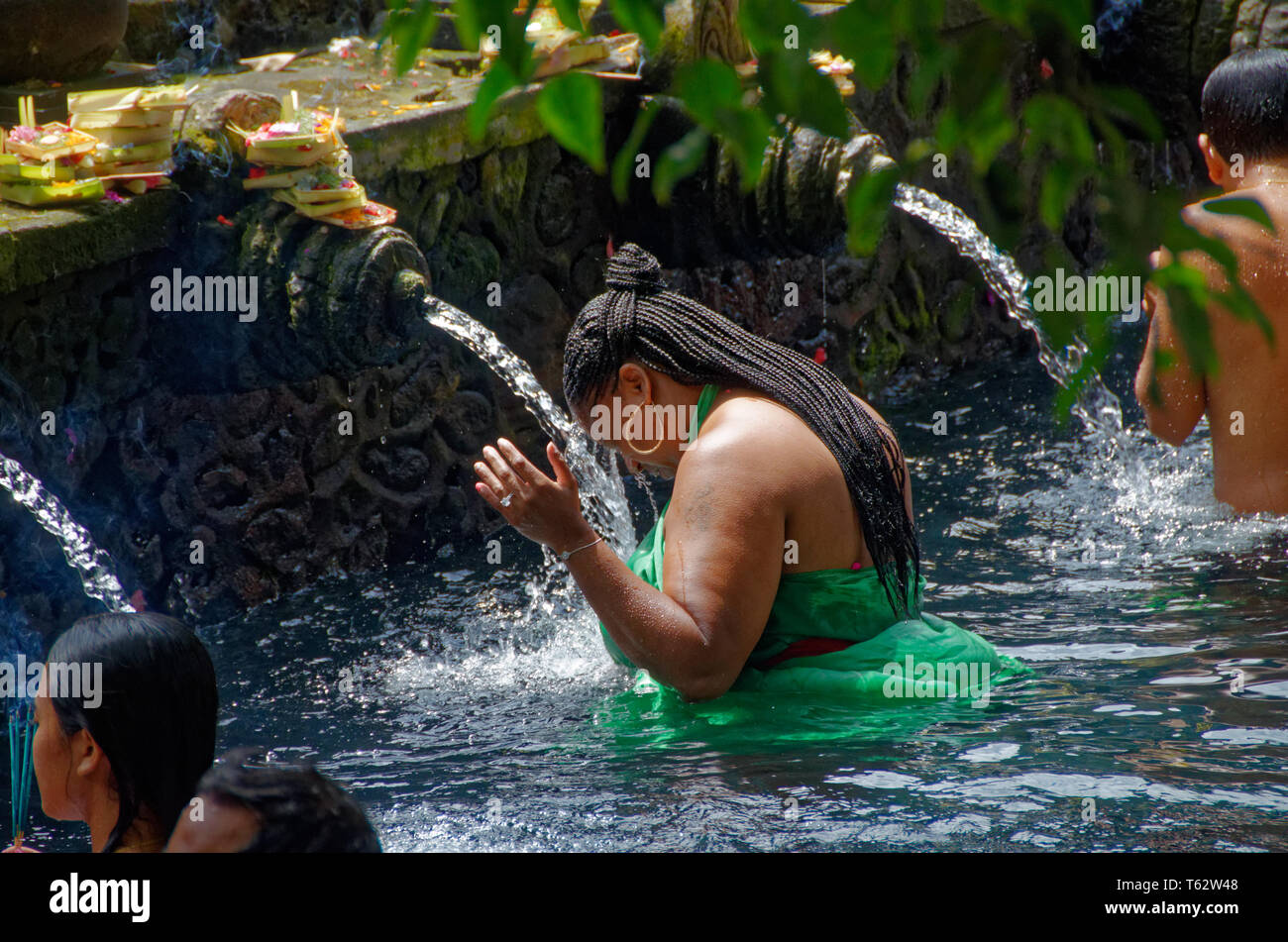 Tourists and worshippers cleansing at Tampak Siring, the Holy Spring ...