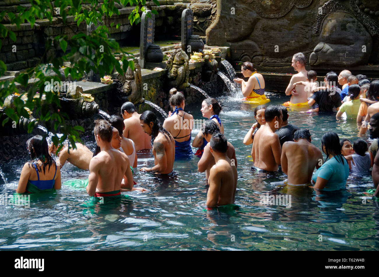 Tourists and worshippers cleansing at Tampak Siring, the Holy Spring ...
