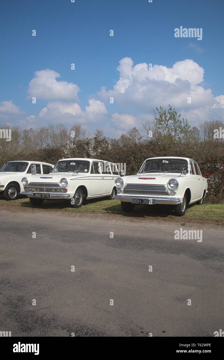 A PAIR OF WHITE CLASSIC FORD CORTINA MARK 1 CARS ONE SALOON AND 1 ...