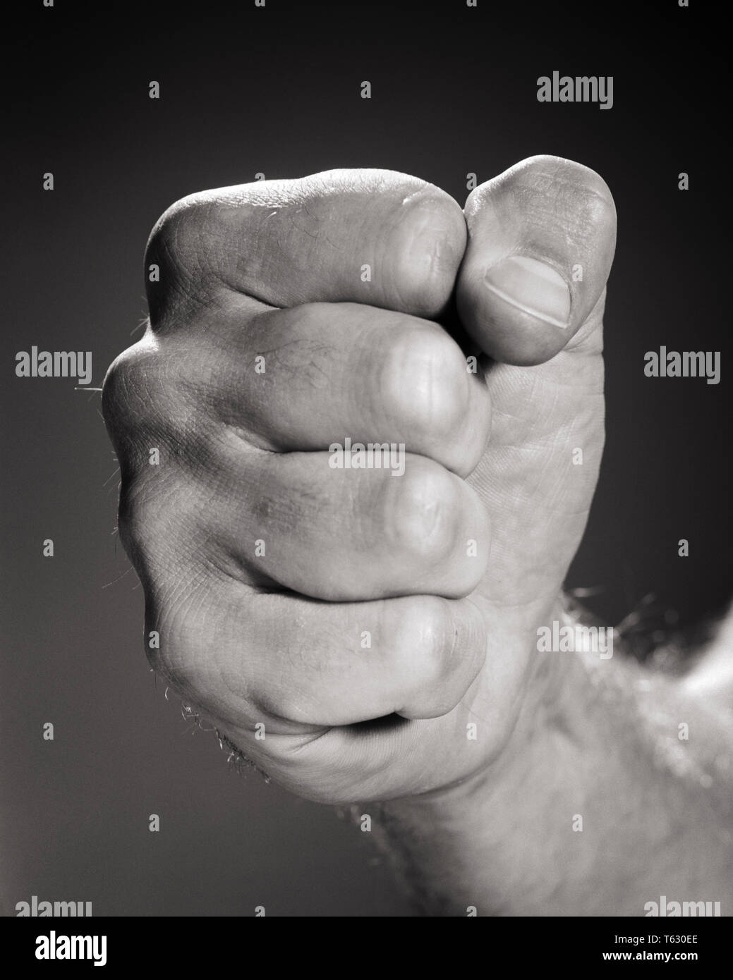 1950s 1960s MAN’S FIST COMING TOWARDS THE CAMERA READY FOR A FIST BUMP ...