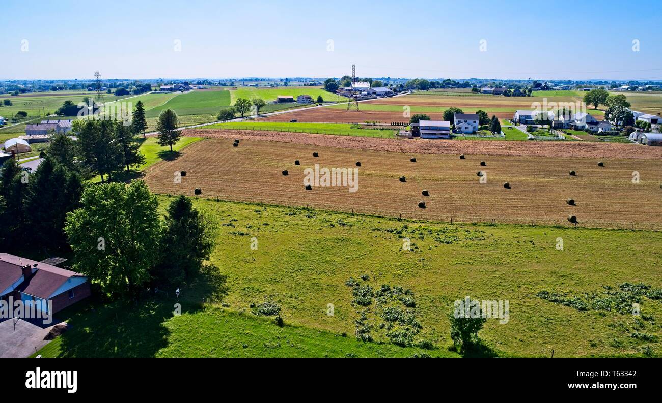 Aerial View of Amish Farmers Harvesting there Crops in Summer Stock ...
