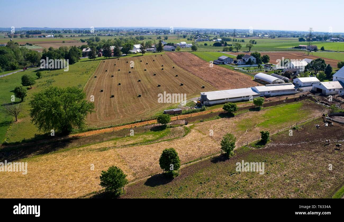 Aerial View of Amish Farmers Harvesting there Crops in Summer Stock ...