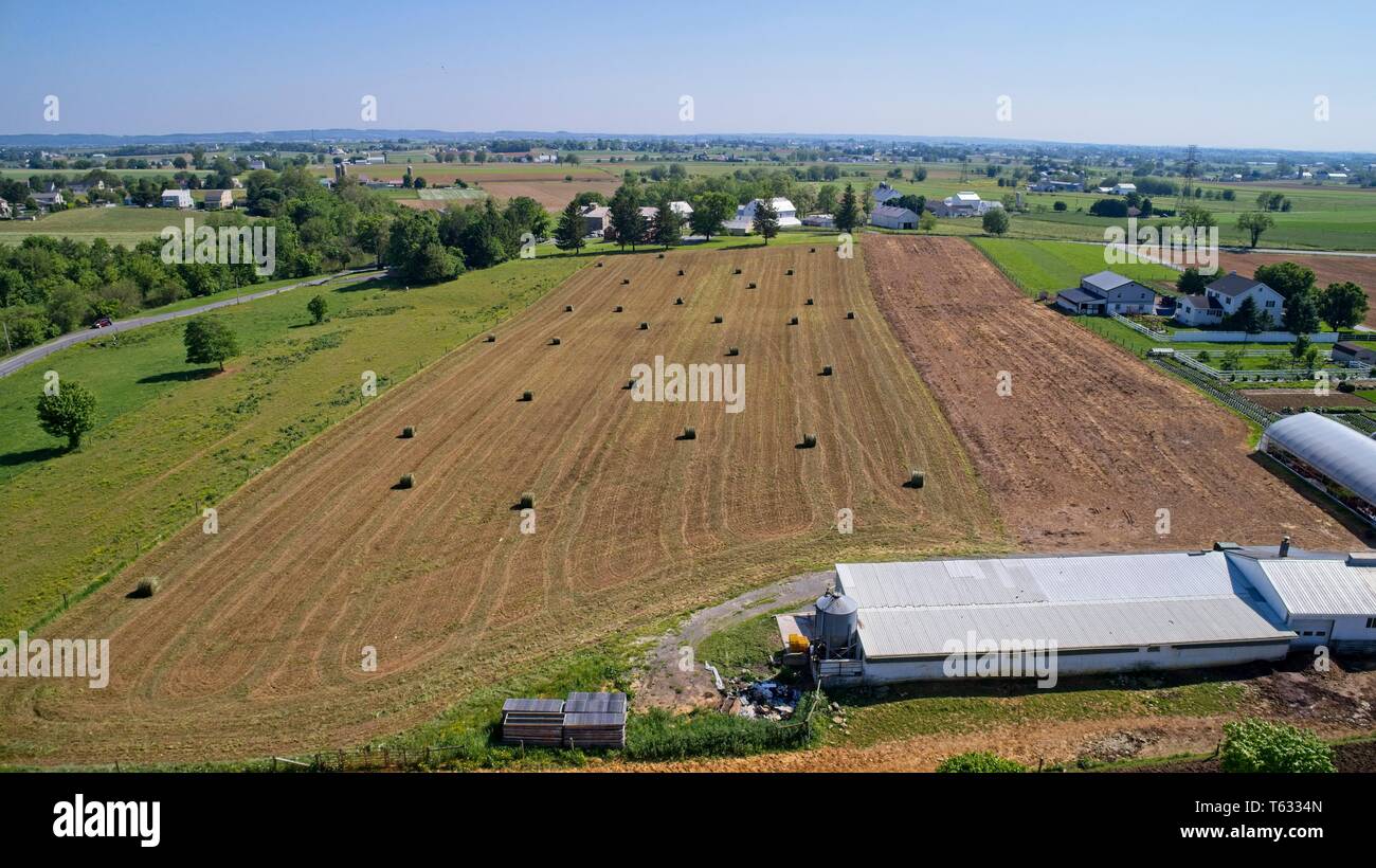 Aerial View of Amish Farmers Harvesting there Crops in Summer Stock ...