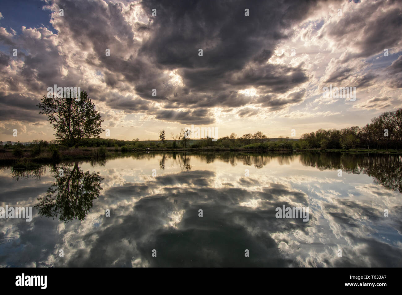 Reflections on the lake water Stock Photo - Alamy