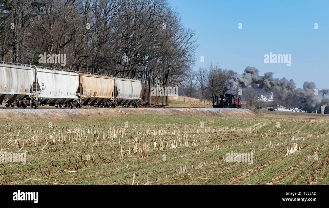 Steam Locomotive and Freight Hopper Cars in Amish Countryside Stock ...