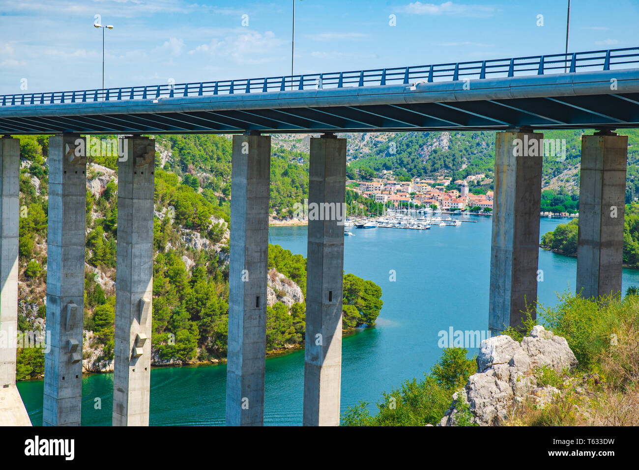 highway bridge cross river with blue water. summer time. road trip ...