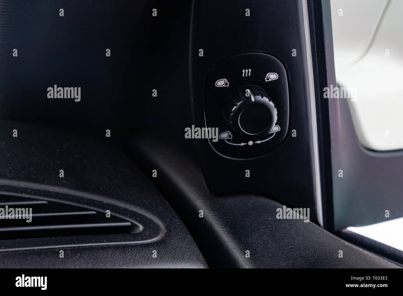 The buttons for controlling the mirrors electric drive on the center ...