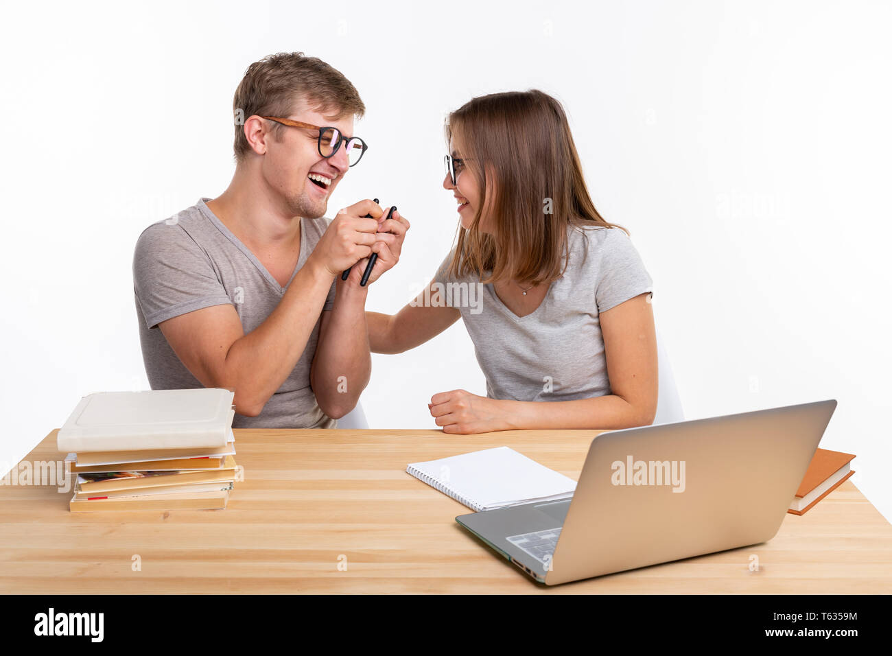 People and education concept - Two students have fun while working ...
