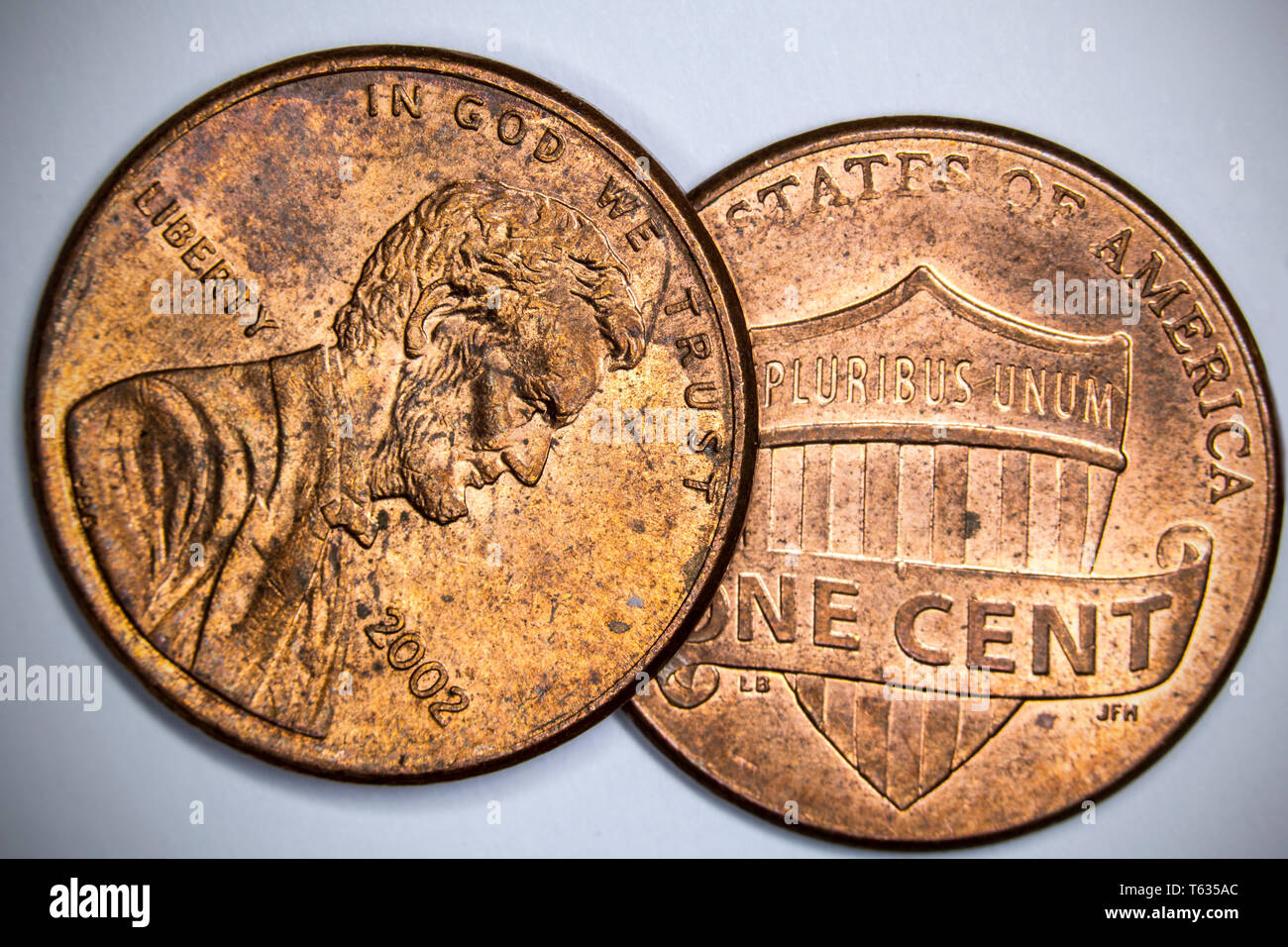 Close up of Two Pennies on a White Background Stock Photo - Alamy