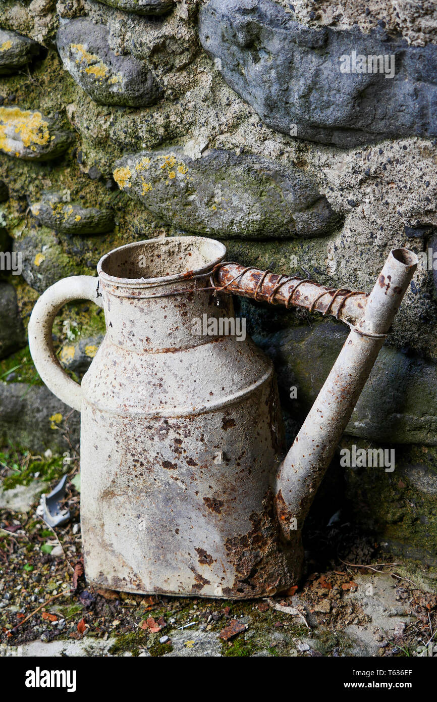 Old rusted watering can, Chomerac, Ardeche, France Stock Photo - Alamy