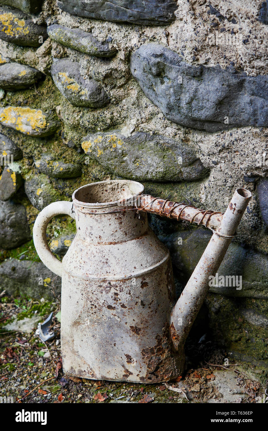 Old rusted watering can, Chomerac, Ardeche, France Stock Photo - Alamy
