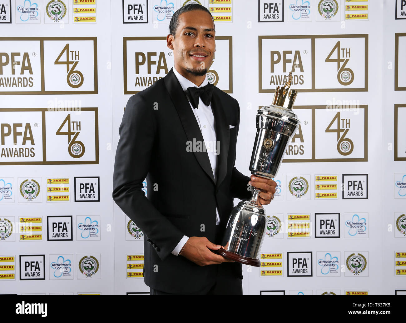 Liverpool's Virgil van Dijk poses with his PFA Player of the Year award ...