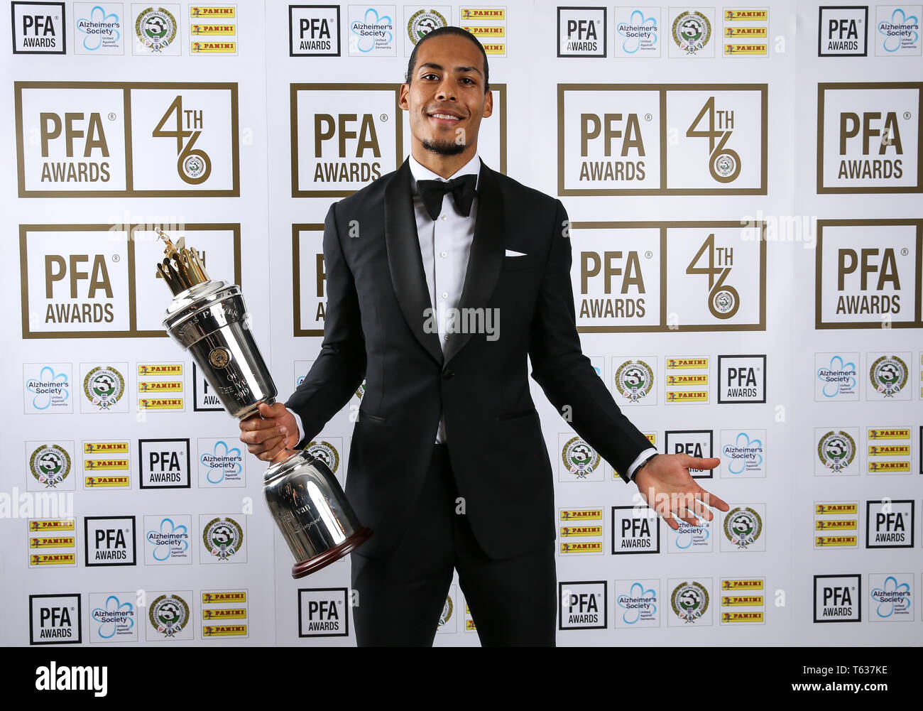 Liverpool's Virgil van Dijk poses with his PFA Player of the Year award ...