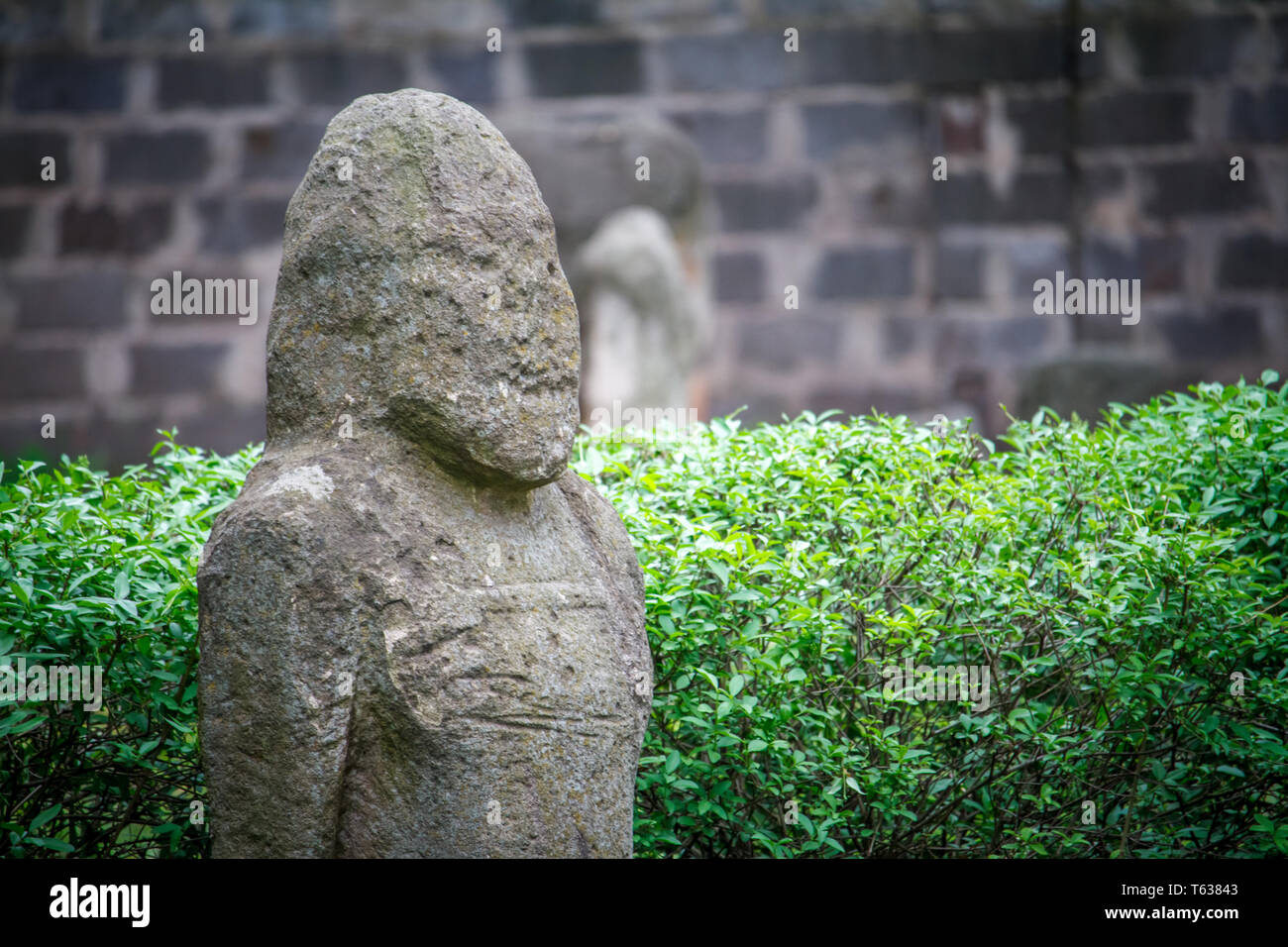 Ancient statue of Polovtsian stone woman or boundary stone in the city ...