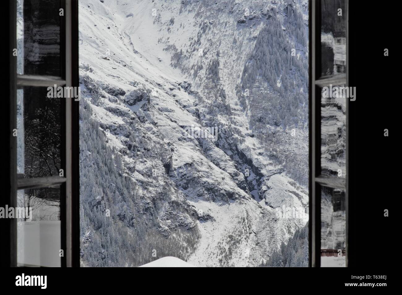 Window view over snowy Swiss alps Stock Photo - Alamy