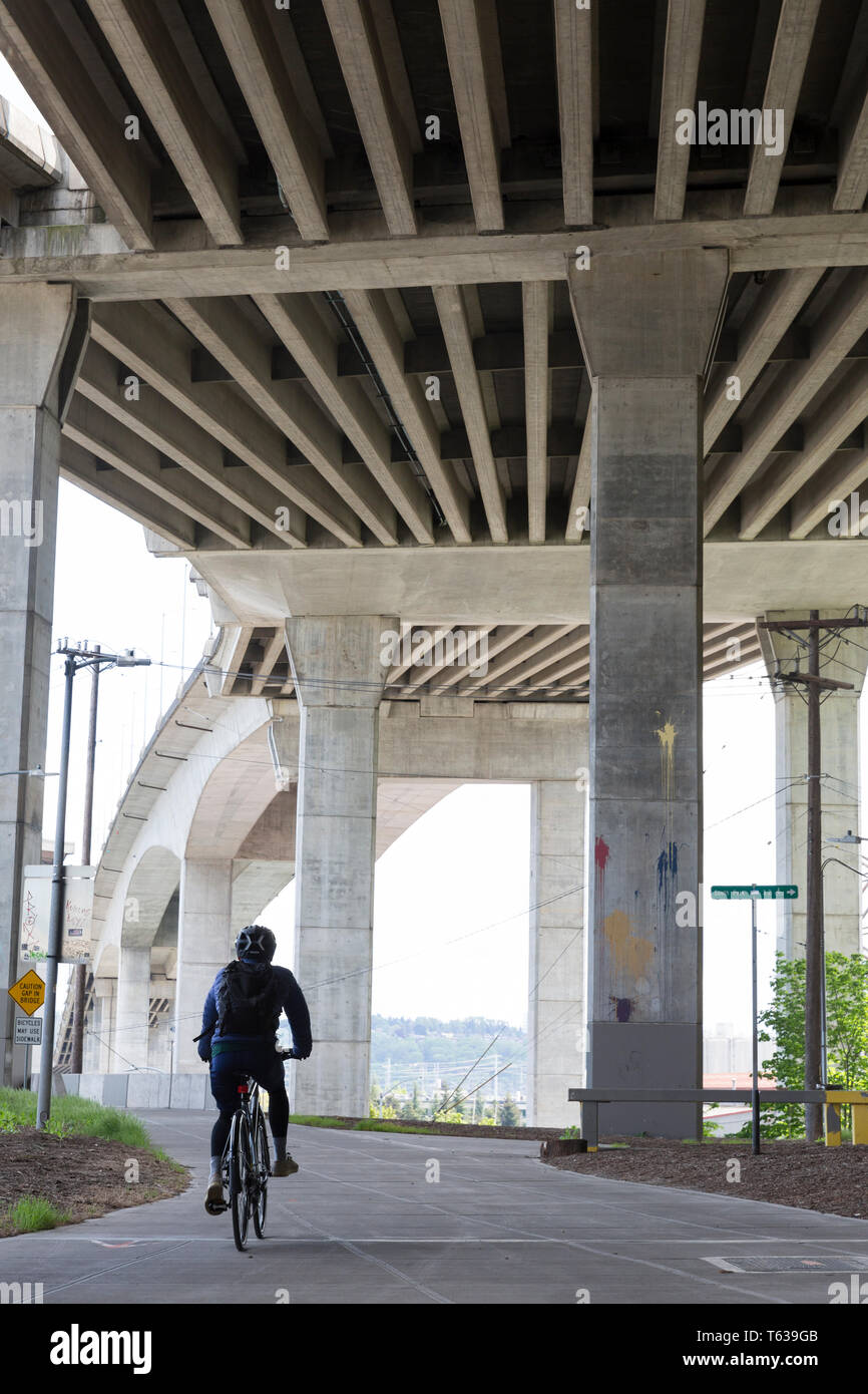 Seattle, Washington: A cyclist rides along the West Seattle Bridge ...