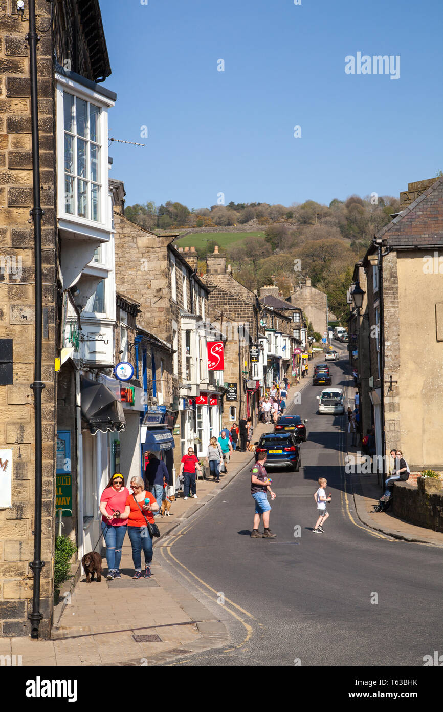 Tourists and holiday makers crossing the road in the Nidderdale town of ...