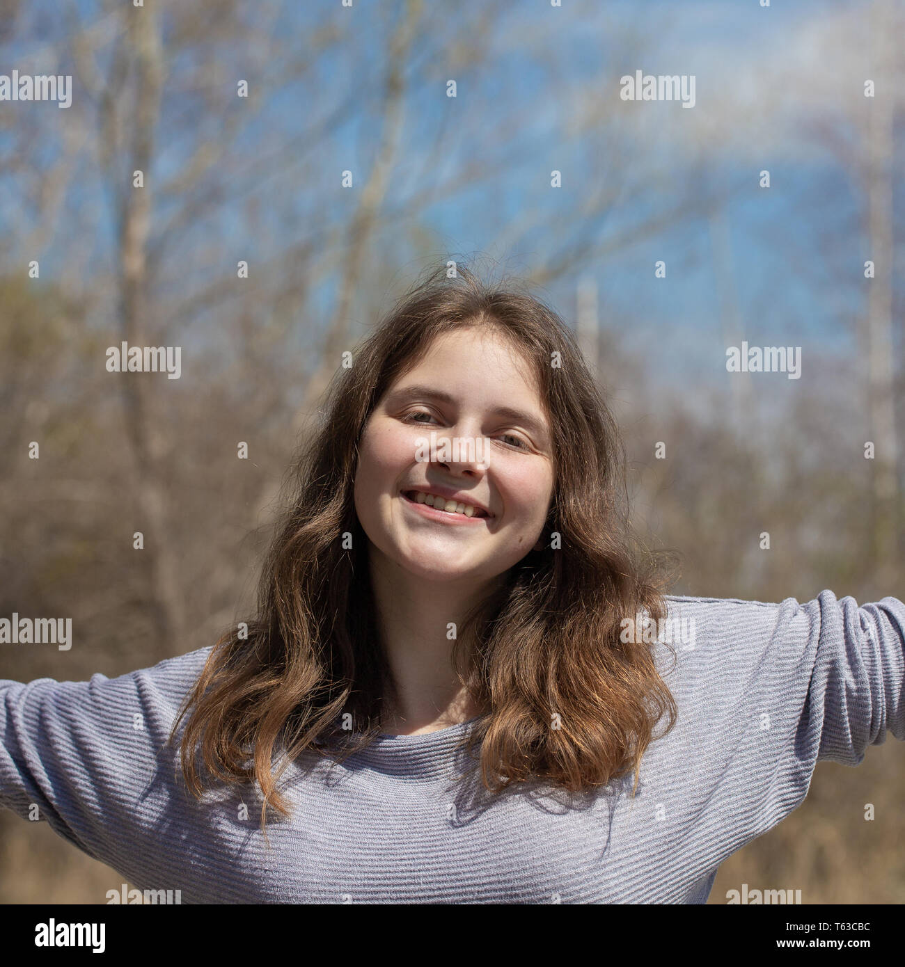 Young girl on nature with positive emotions. Relaxed, pleased with a ...