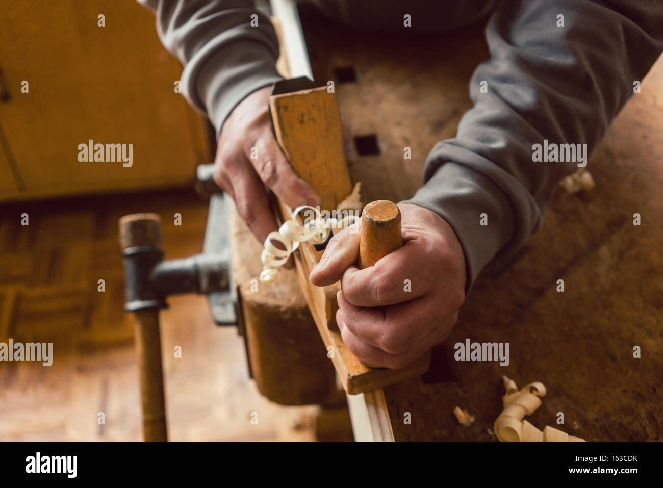 Top view of carpenter hand working with wood planer Stock Photo - Alamy