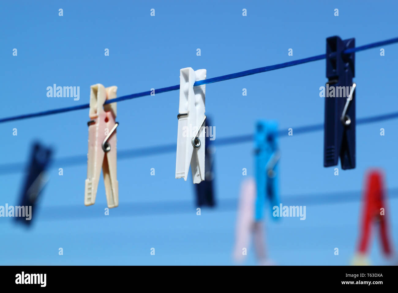 Cloth pegs under the blue sky hi-res stock photography and images - Alamy