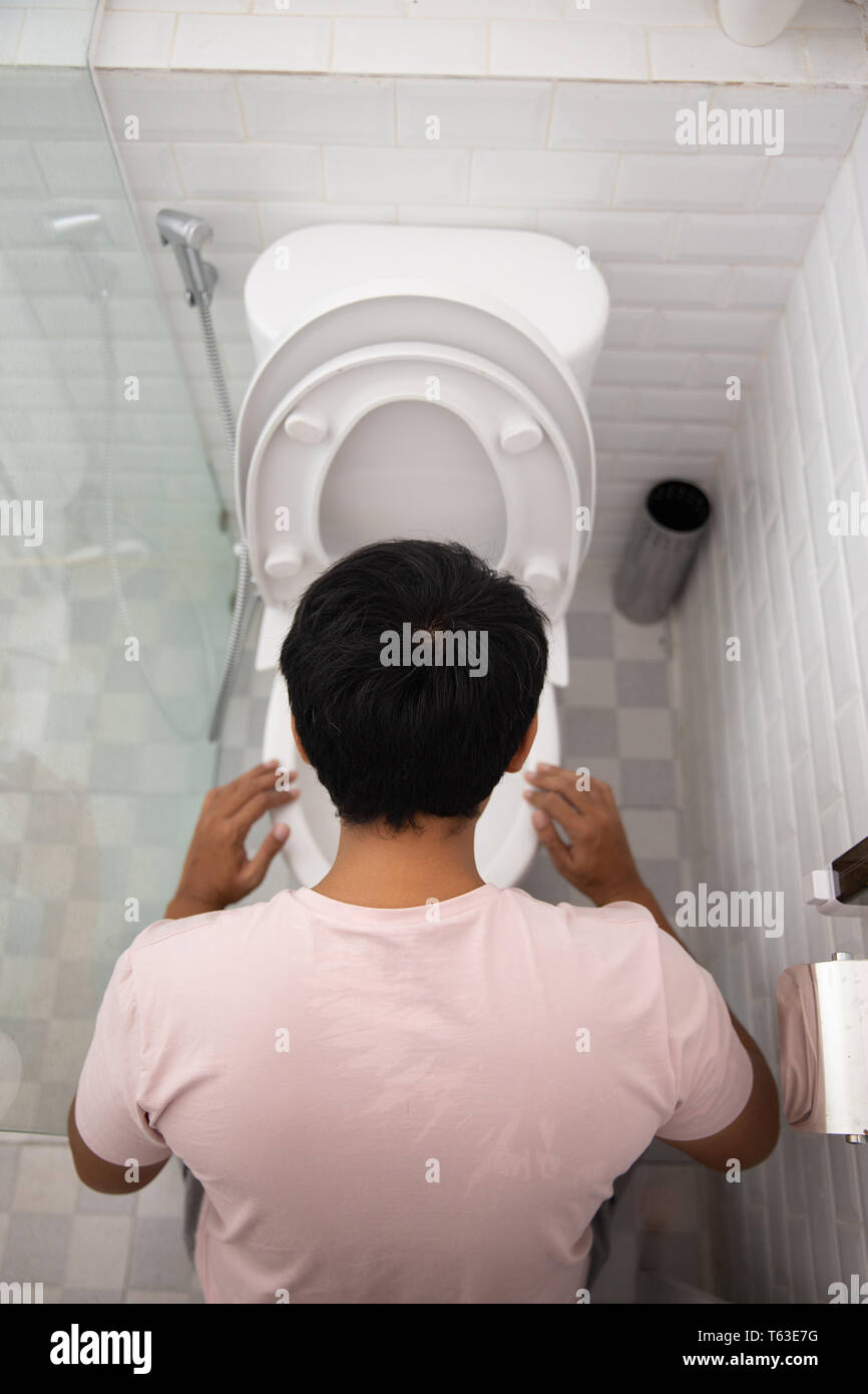 male puke on toilet shoot Stock Photo - Alamy