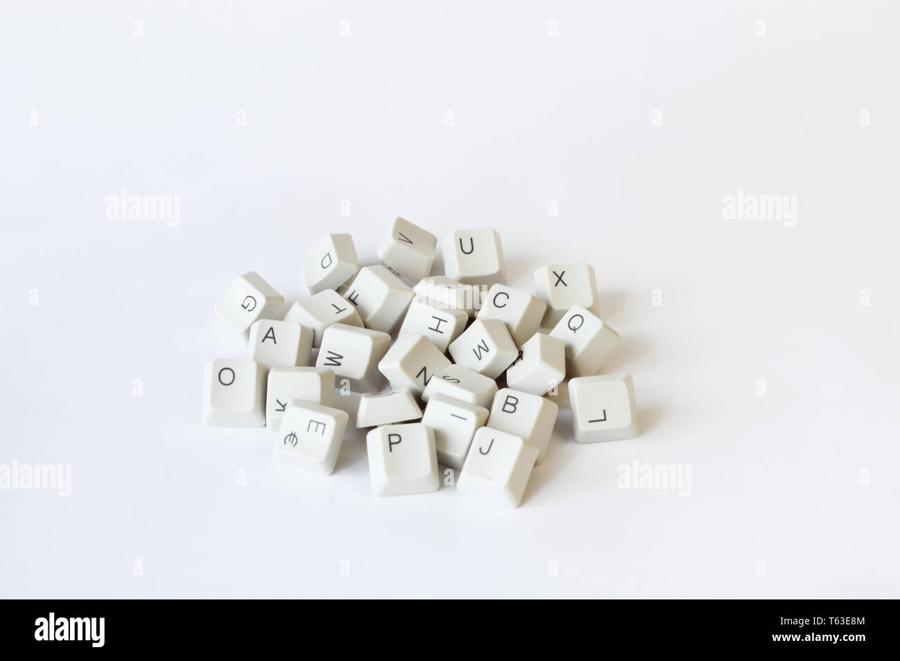scattered keyboard keys on white background Stock Photo - Alamy
