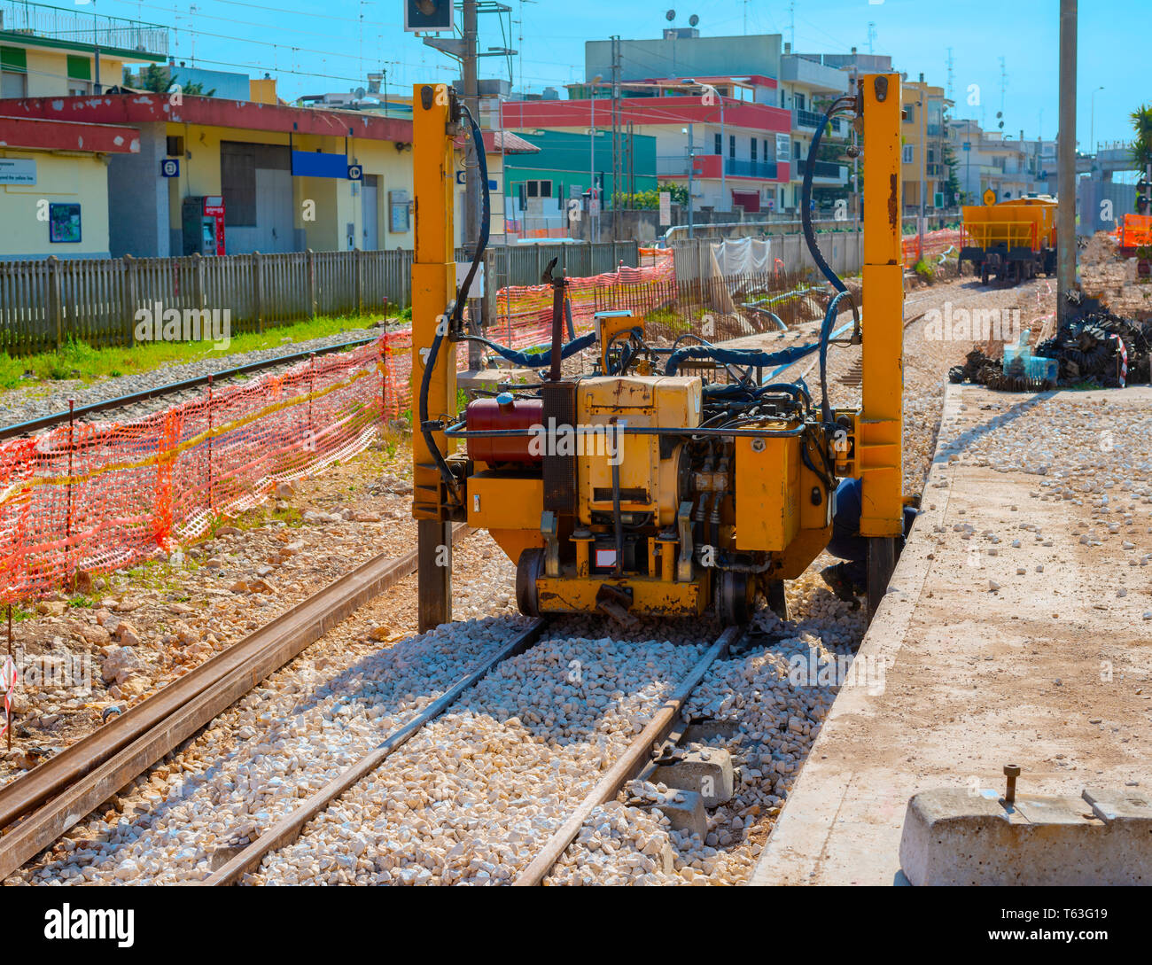 Construction of a new railway line at a city station. Hydraulic lifting ...