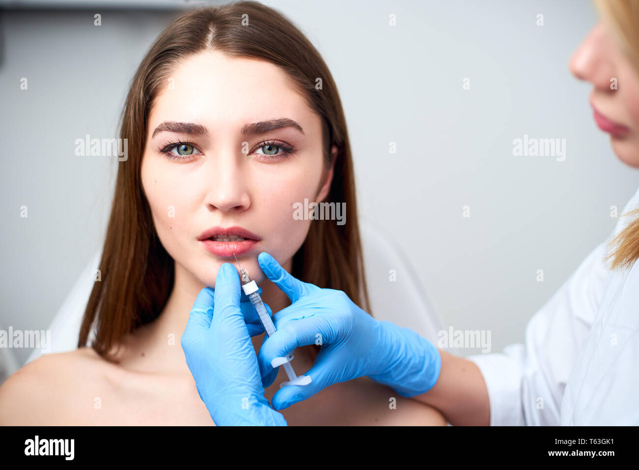 Lip Augmentation. Beautiful Young Woman's Mouth Receiving Hyaluronic ...