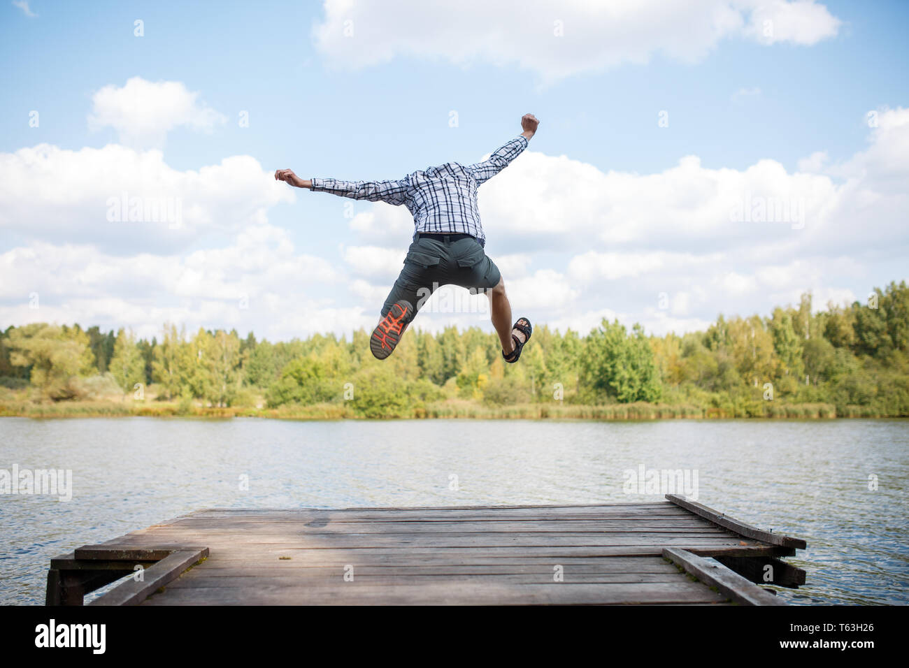 Back person jumping hi-res stock photography and images - Alamy