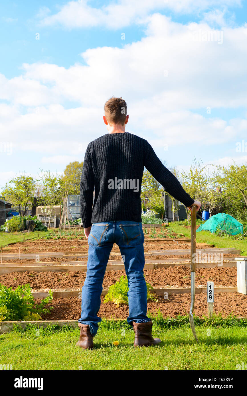 Male gardener at allotment with work tools Stock Photo - Alamy