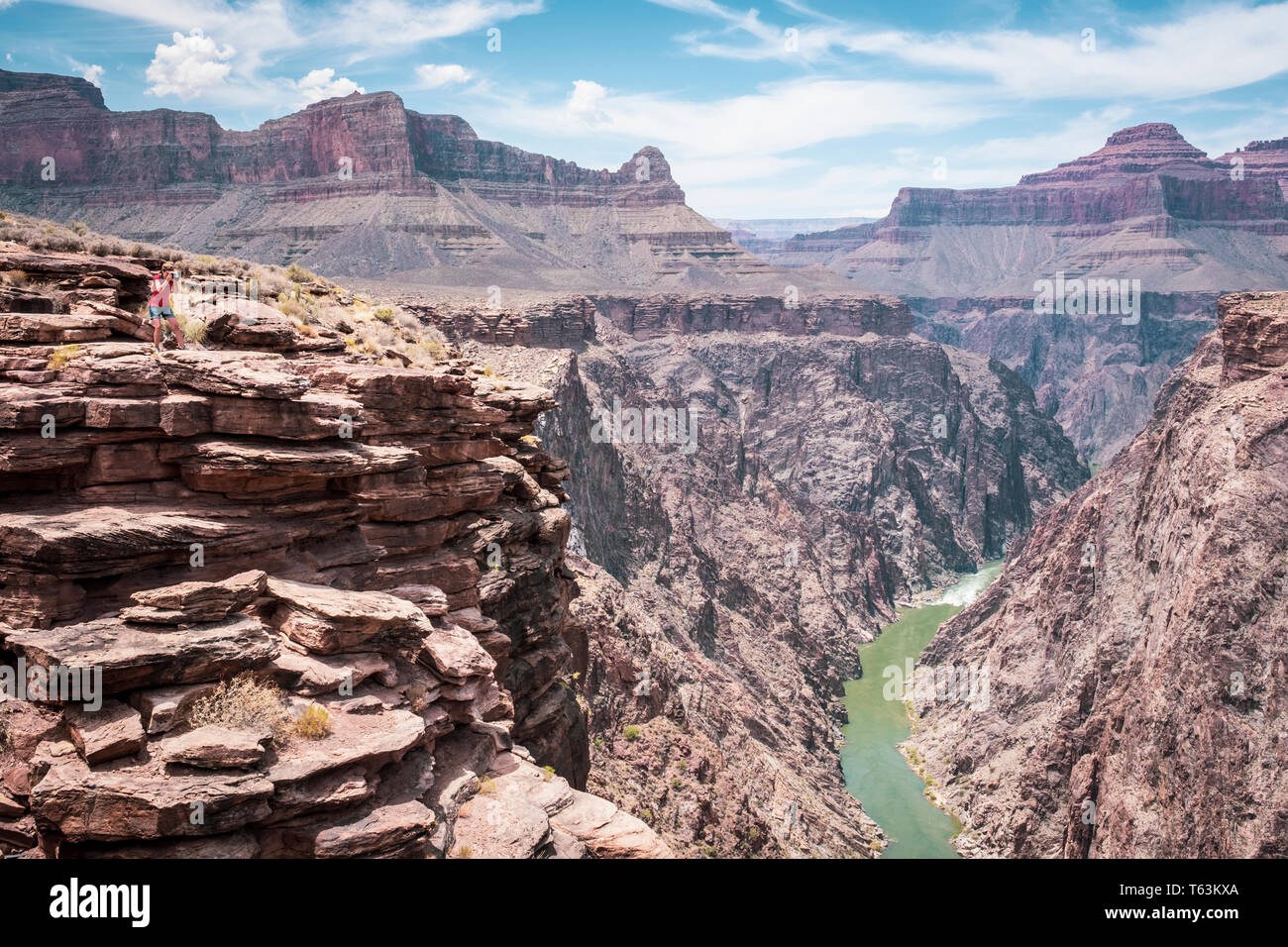 Female visitor photographing a breathtaking view of the Colorado River ...