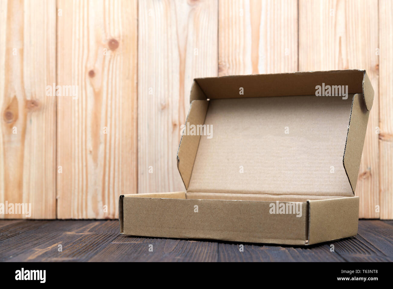Empty Package brown cardboard box or tray on wooden background, mock up ...