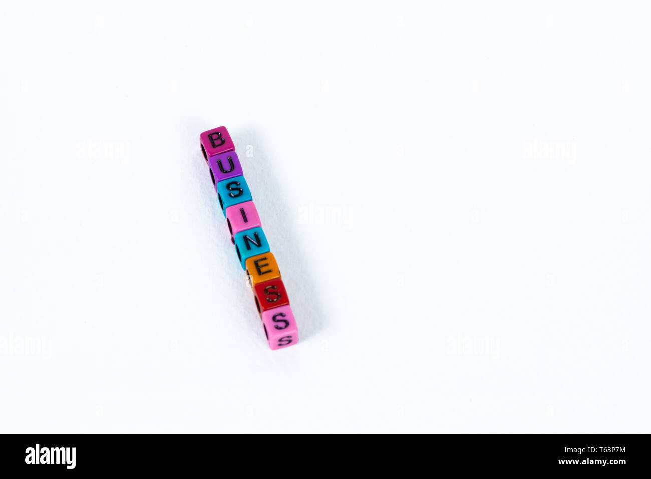BUSINESS text made from colorful beads or letter bead on white ...