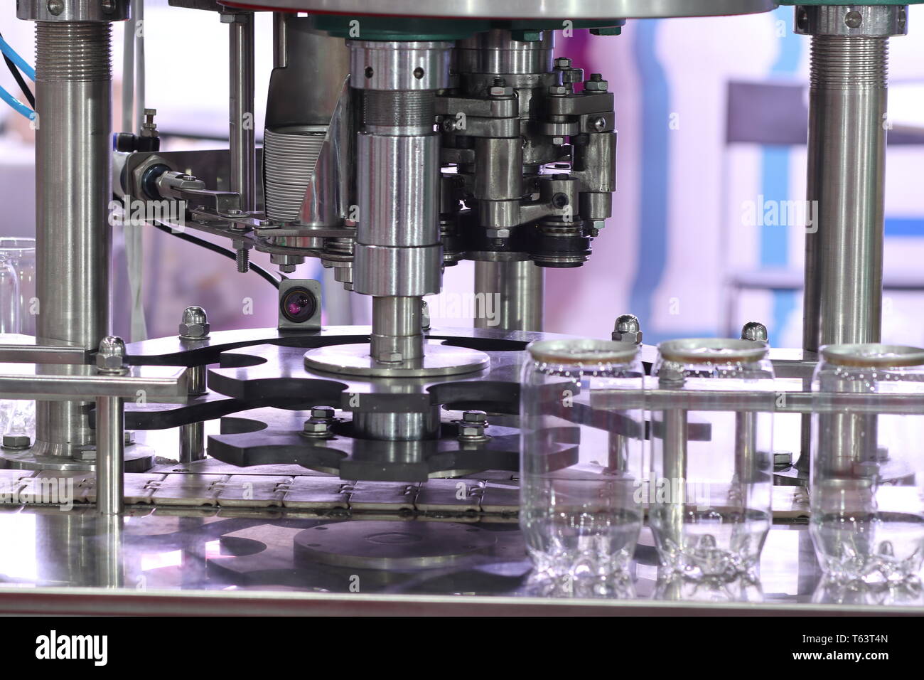 Aluminum lid packing machine for plastic can ; factory Stock Photo - Alamy