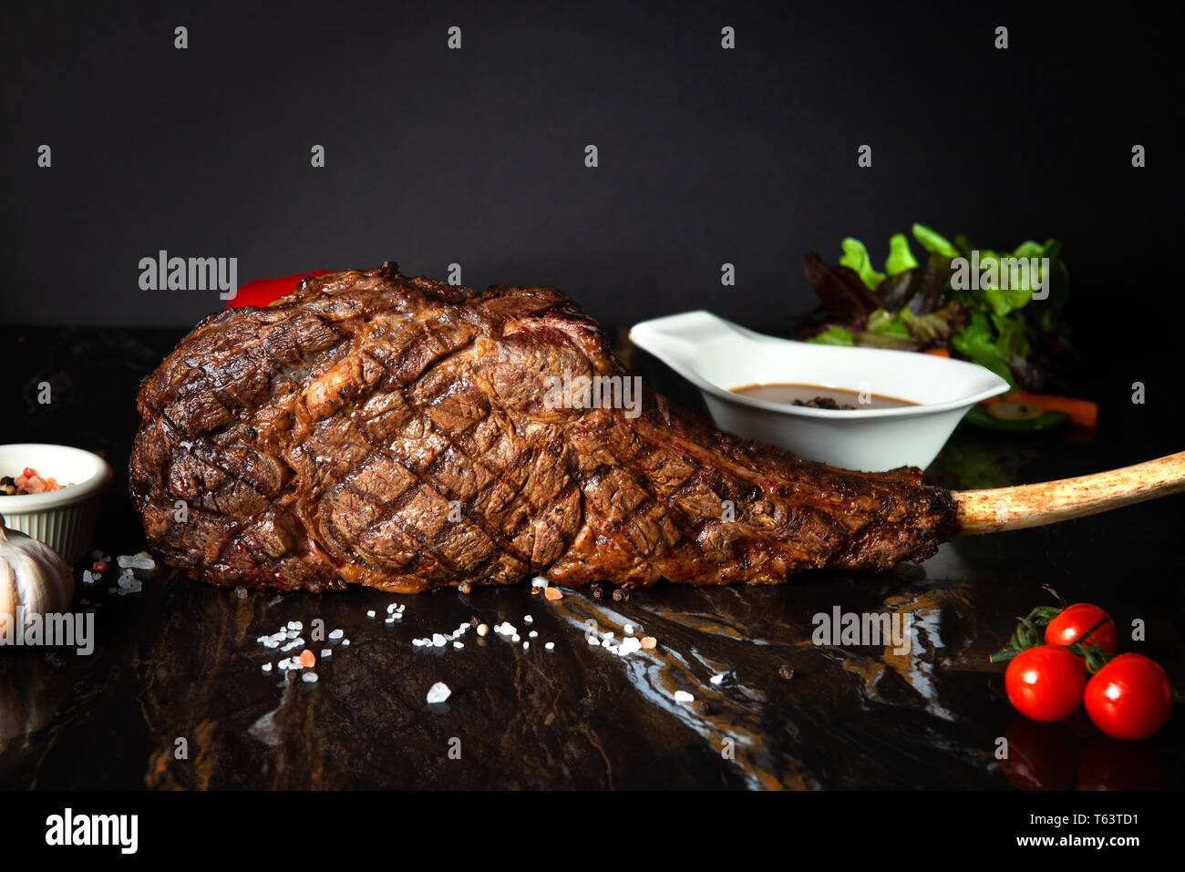 beautifully seared tomahawk steak, medium rare to rare Stock Photo - Alamy