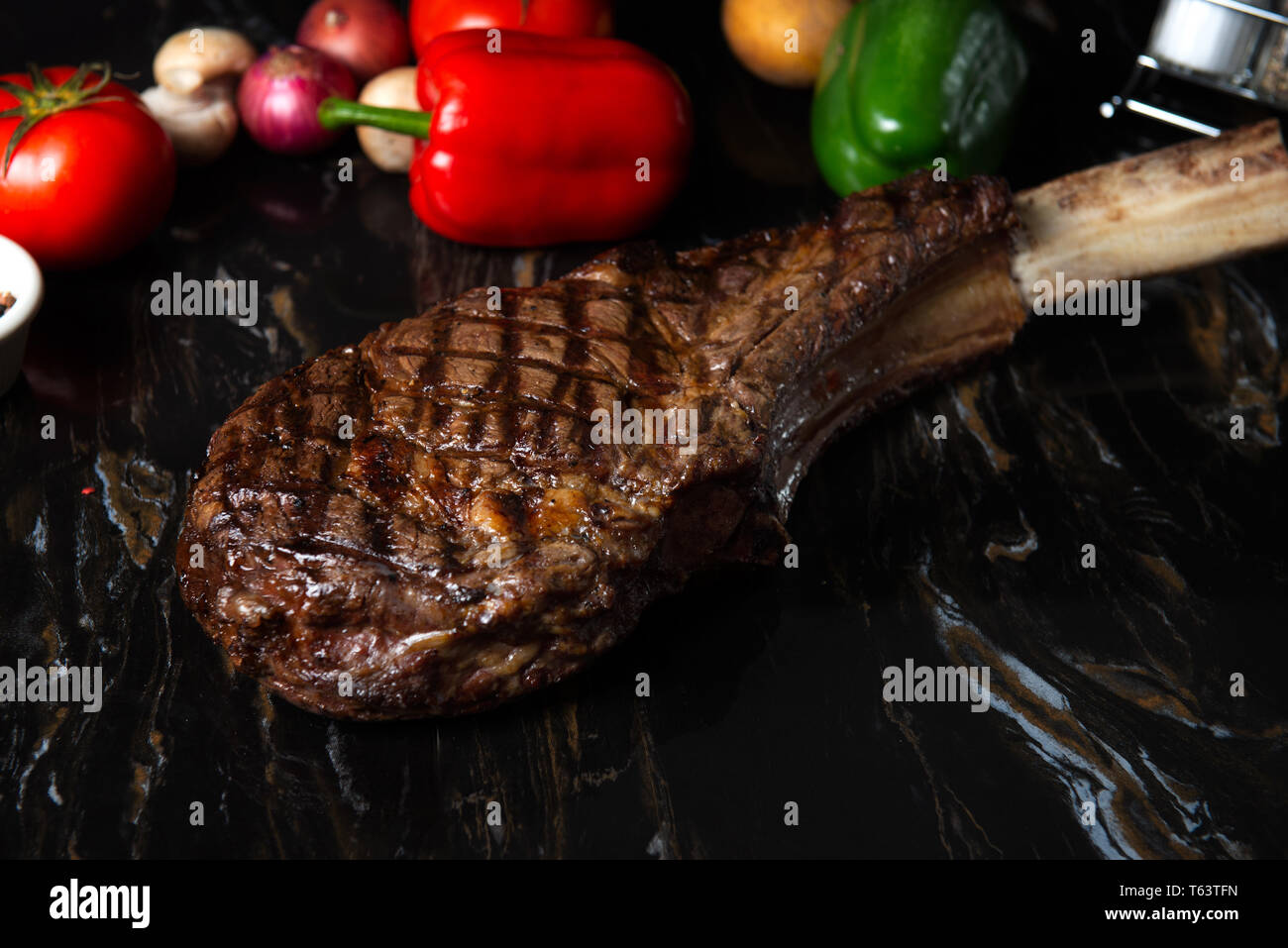beautifully seared tomahawk steak, medium rare to rare Stock Photo - Alamy