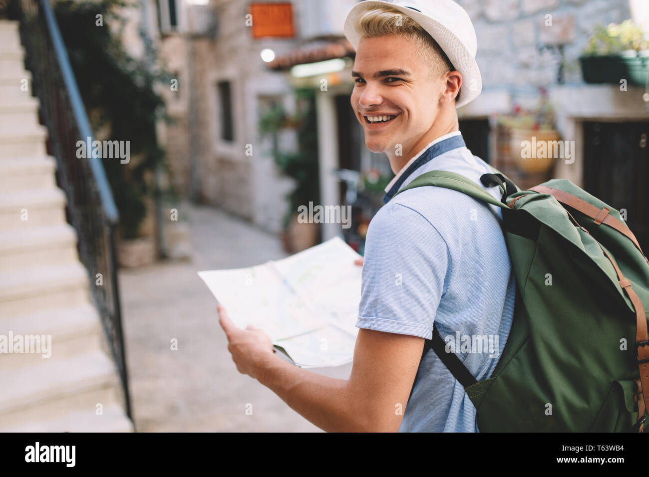 Male tourist with guide map hi-res stock photography and images - Alamy