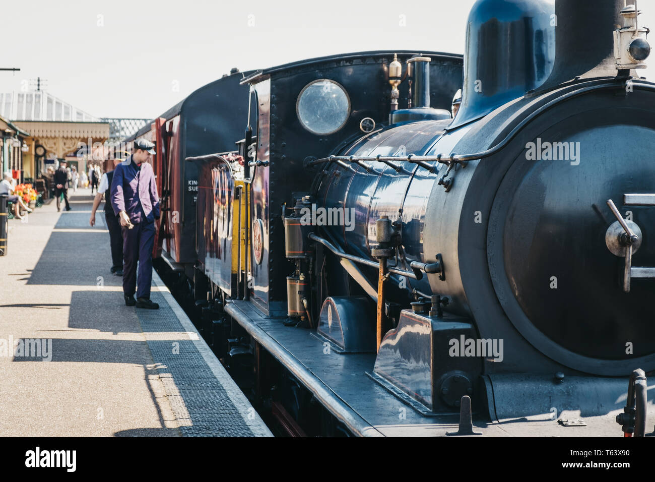 Sheringham, UK - April 21, 2019: Staff walking on platform next to The ...