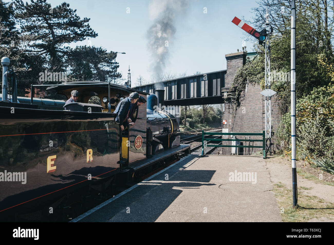 Sheringham, UK - April 21, 2019: Crew looking out the cab on The Poppy ...