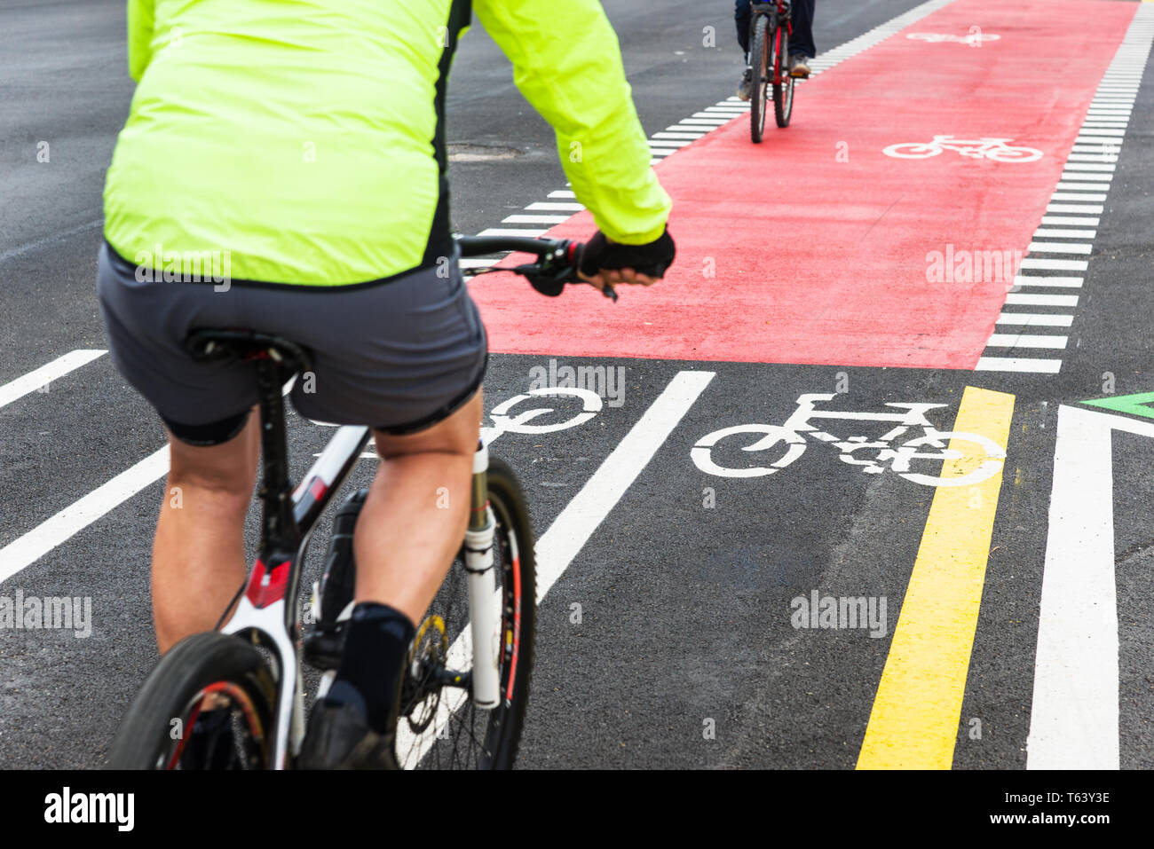cyclists in city street Stock Photo - Alamy