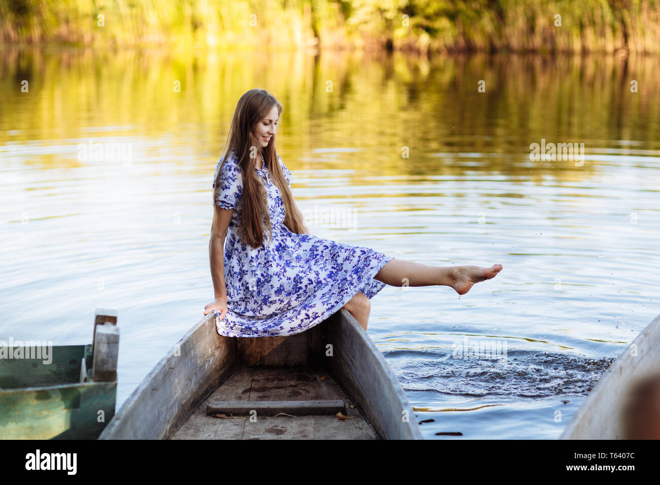 Lifestyle portrait of young beautiful woman sitting at motorboat. girl ...