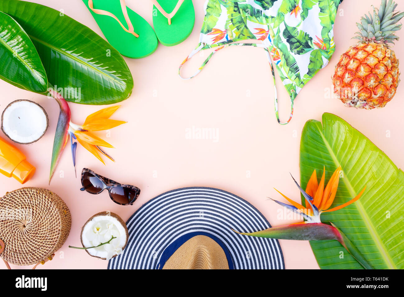 Summer flat lay top view frame with beach accessories frame on pink ...